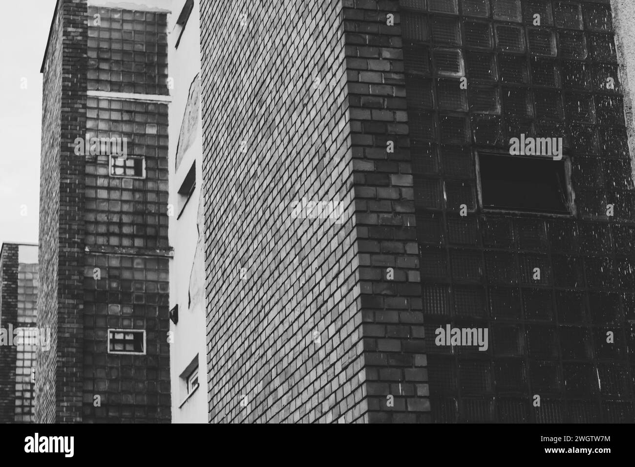 Black an white brick block building Stock Photo - Alamy