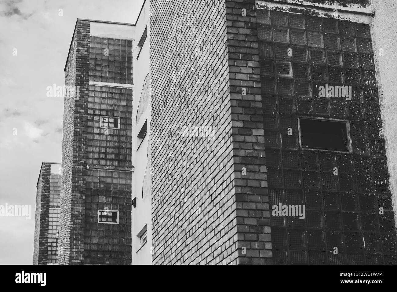 Black an white brick block building Stock Photo - Alamy