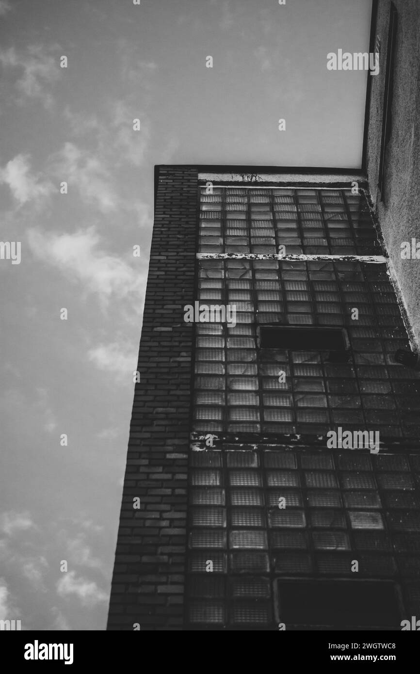 Black an white brick block building Stock Photo - Alamy