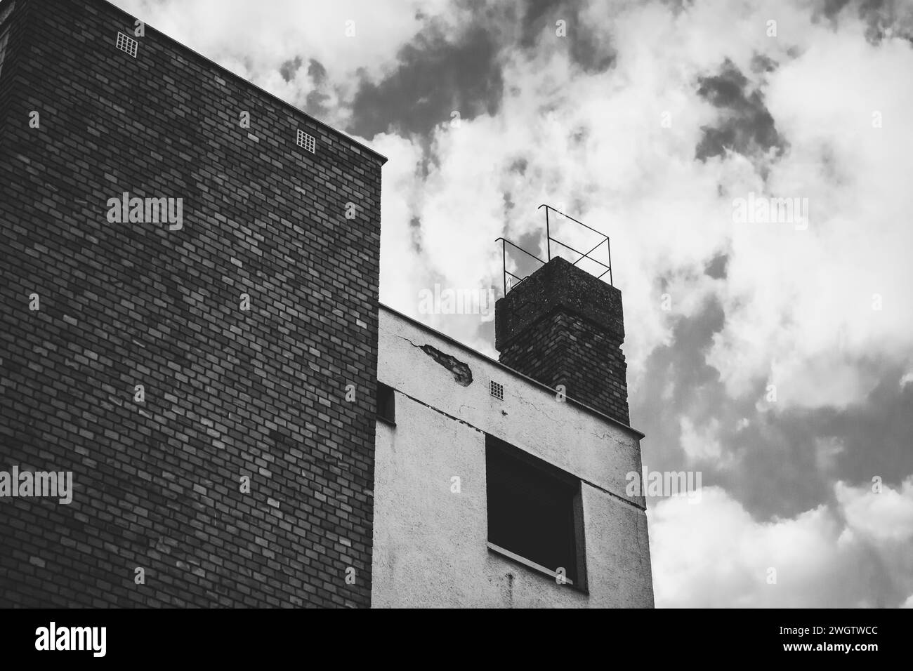 Black an white brick block building Stock Photo - Alamy