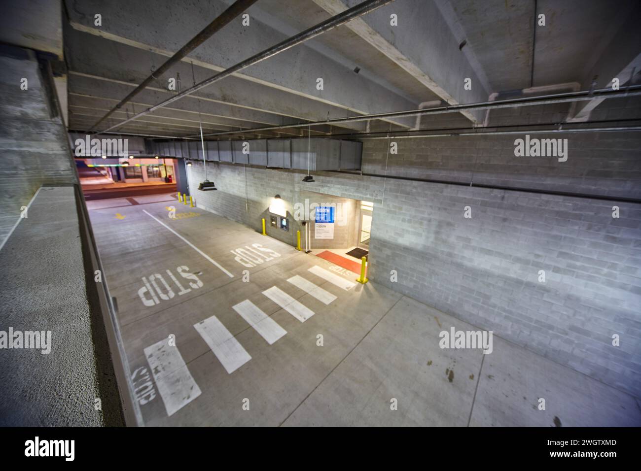 Empty Urban Parking Garage with Safety Features and Directional ...