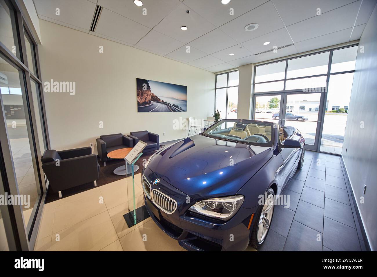 Luxury Convertible Showcase in Modern Car Dealership Interior Stock ...