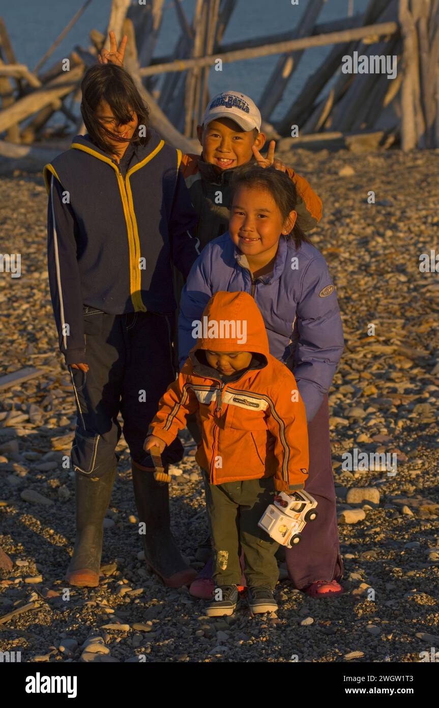 Eskimo Inupiat kids playing at camp on a sandspit along Demarcation bay ...