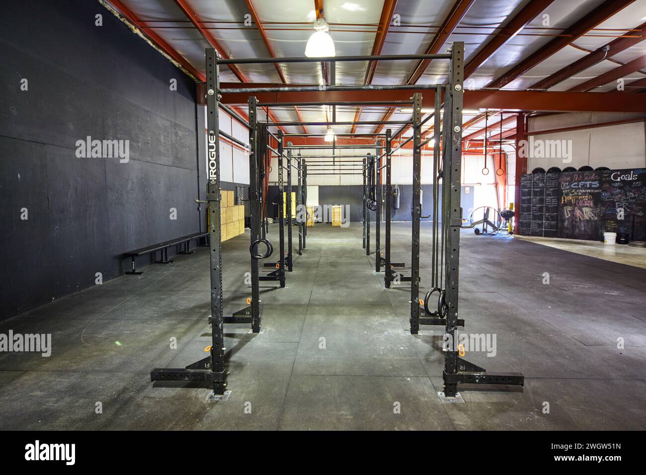 Modern Industrial Gym with Power Racks and Functional Fitness Equipment ...