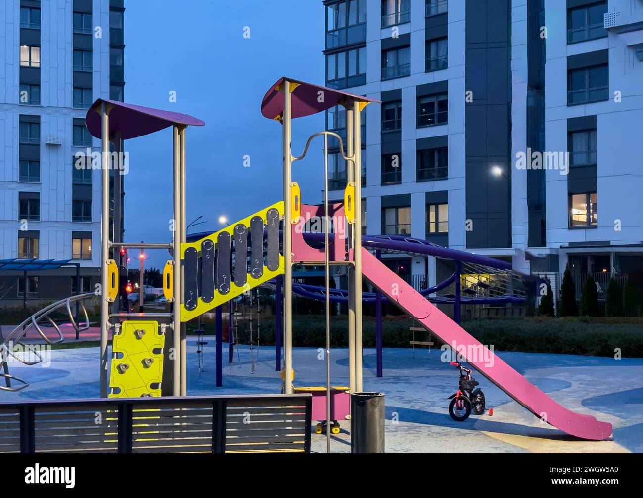 Empty kids playground with modern bright slide at night, evening Stock ...