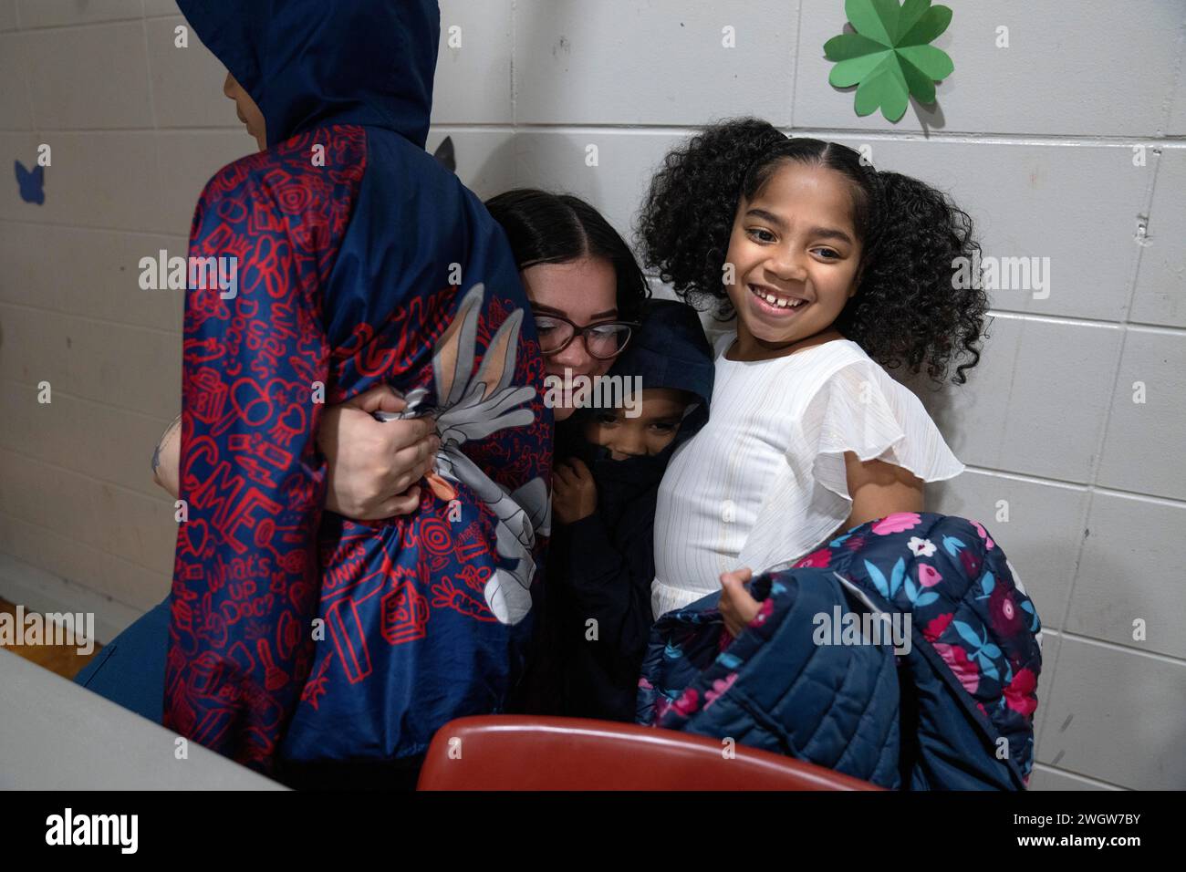 Crystal Martinez hugs three of her five children, from left, Reggie ...