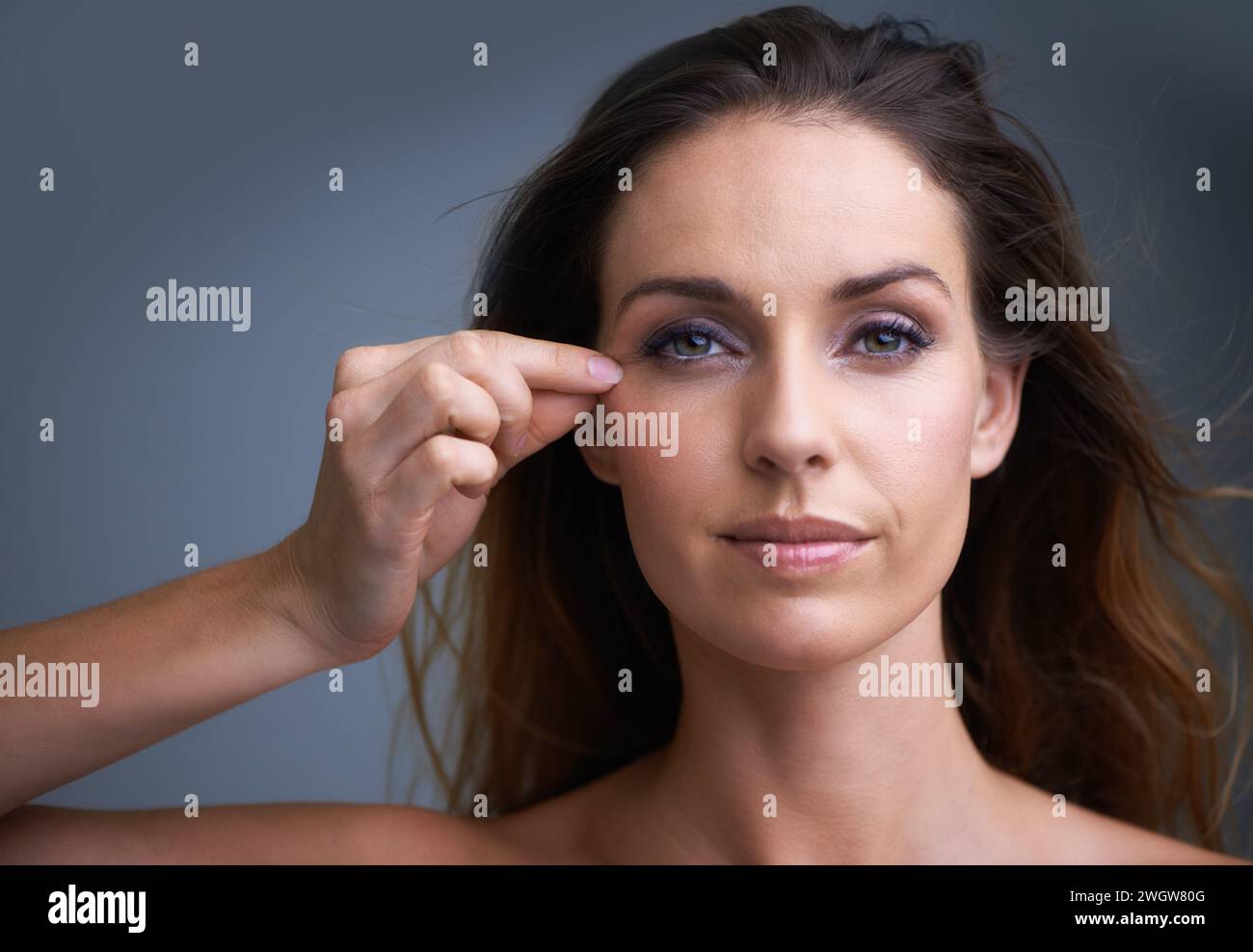 Woman fingers on cheek hi-res stock photography and images - Alamy