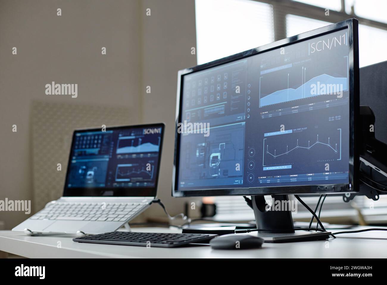 Close up background image of computers on desk in cybersecurity office ...