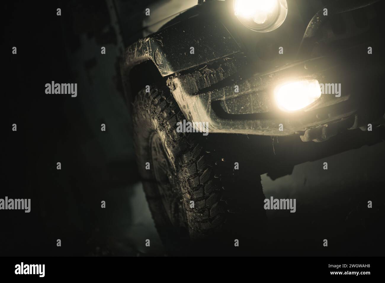 Night Time Off Road Driving Theme. AWD Vehicle Covered by Mud Close Up ...