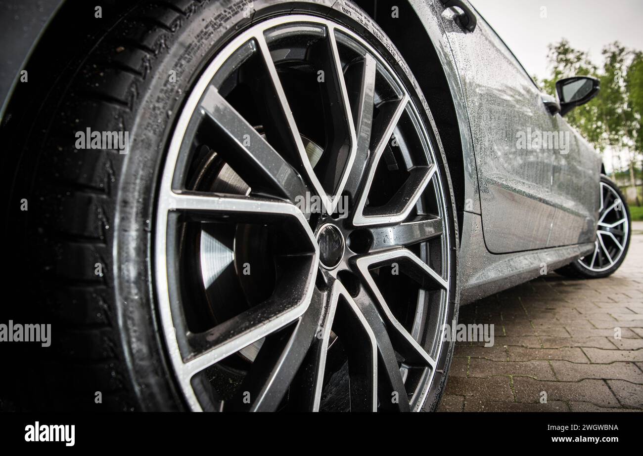 Modern Elegant Alloy Wheel with Low Tire Profile Close Up. Automotive Industry Theme Stock Photo ...