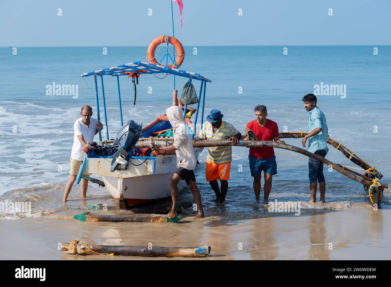 Agonda, Goa, India, Indian men putting a boat on the beach, Editorial ...
