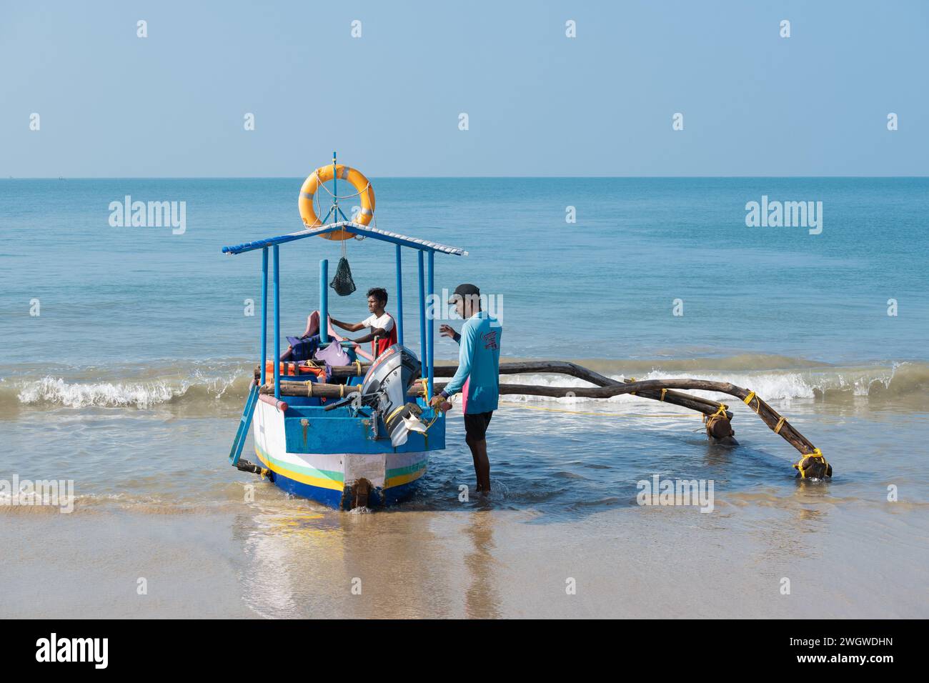 Agonda, Goa, India, Indian men putting out a boat, Editorial only Stock ...