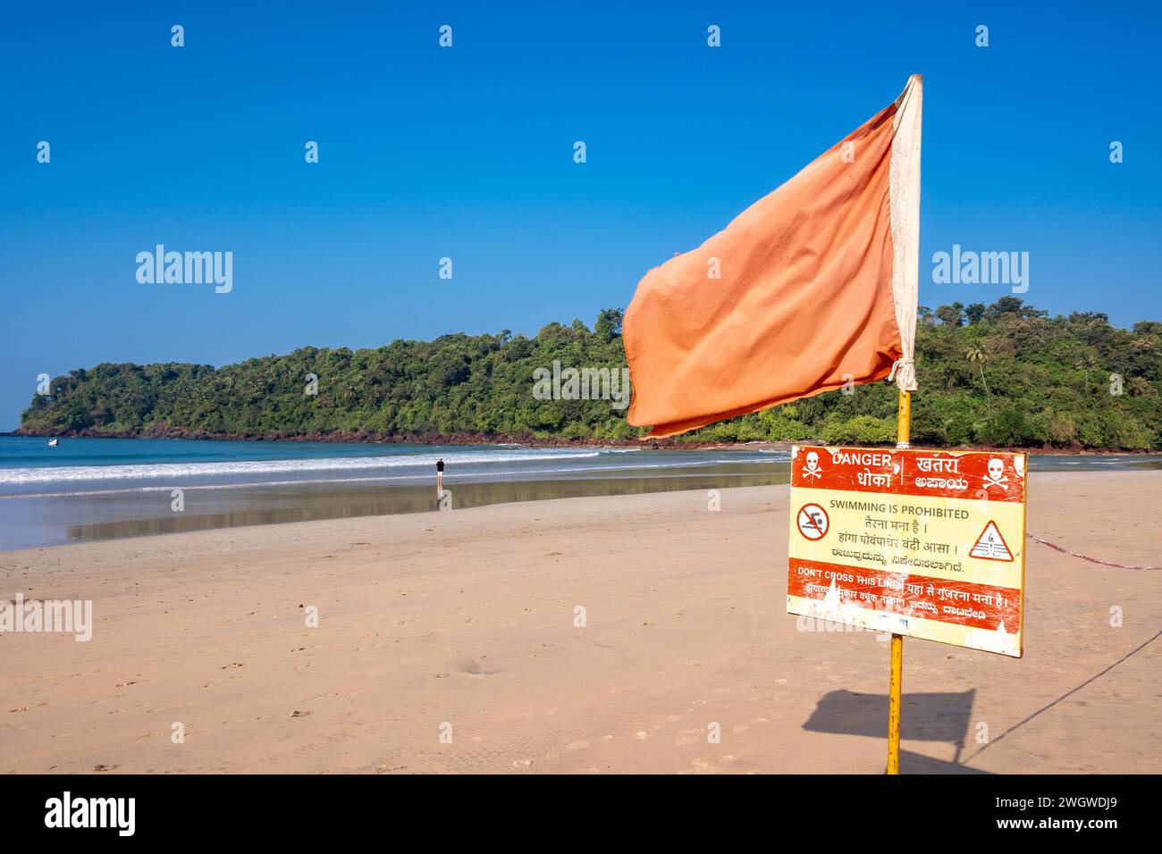 Agonda, Goa, India, Seascape with a peninsula and an orange flag in the ...
