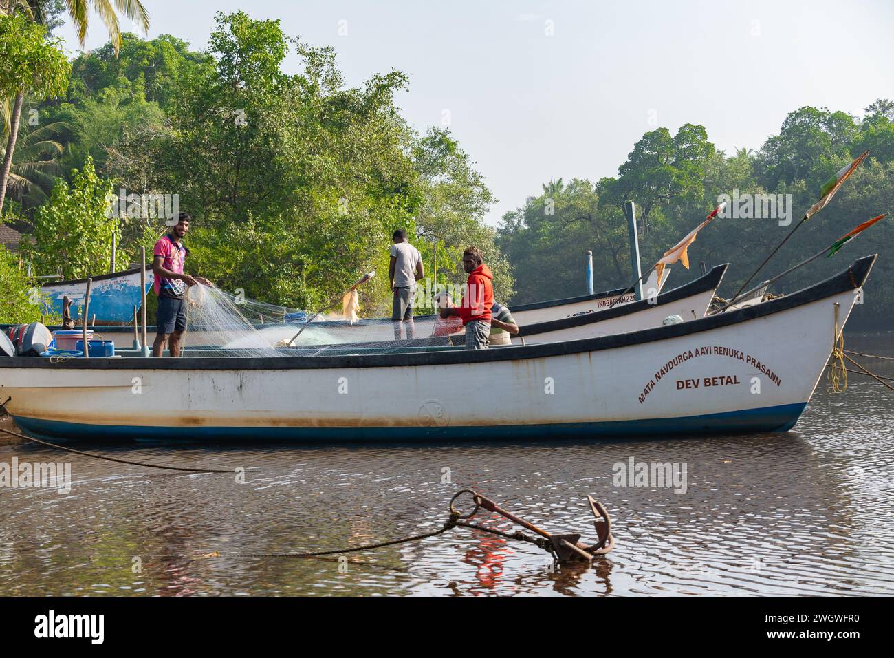 Agonda, Goa, India, Fisherman in the boat at a lagoon of Agonda beach ...