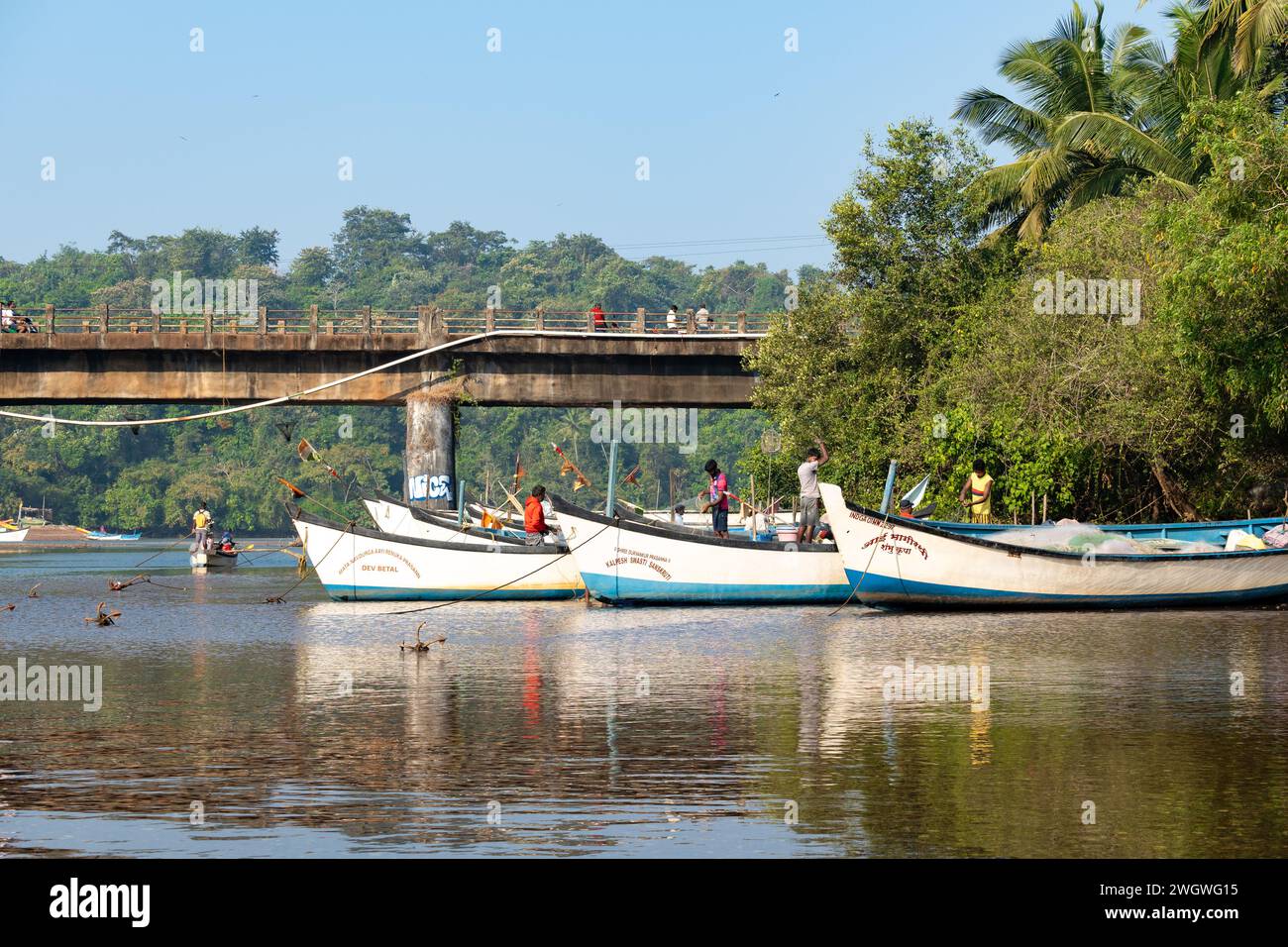 Agonda, Goa, India, Fisherman in the boat at a lagoon of Agonda beach ...