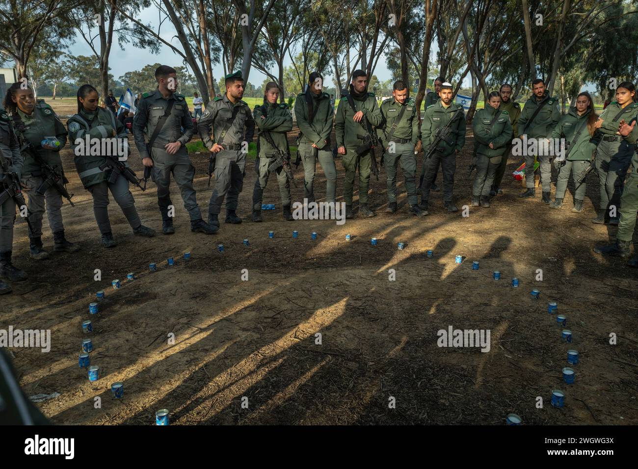 Israeli Border Police make a circle February 6, 2024 as they light ...