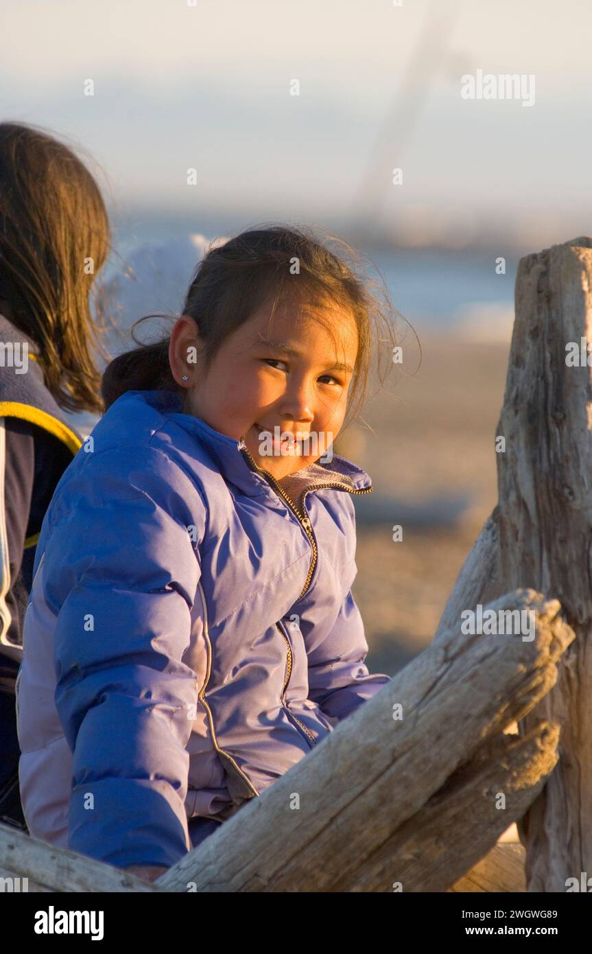 Eskimo Inupiat kids playing at camp on a sandspit along Demarcation bay ...