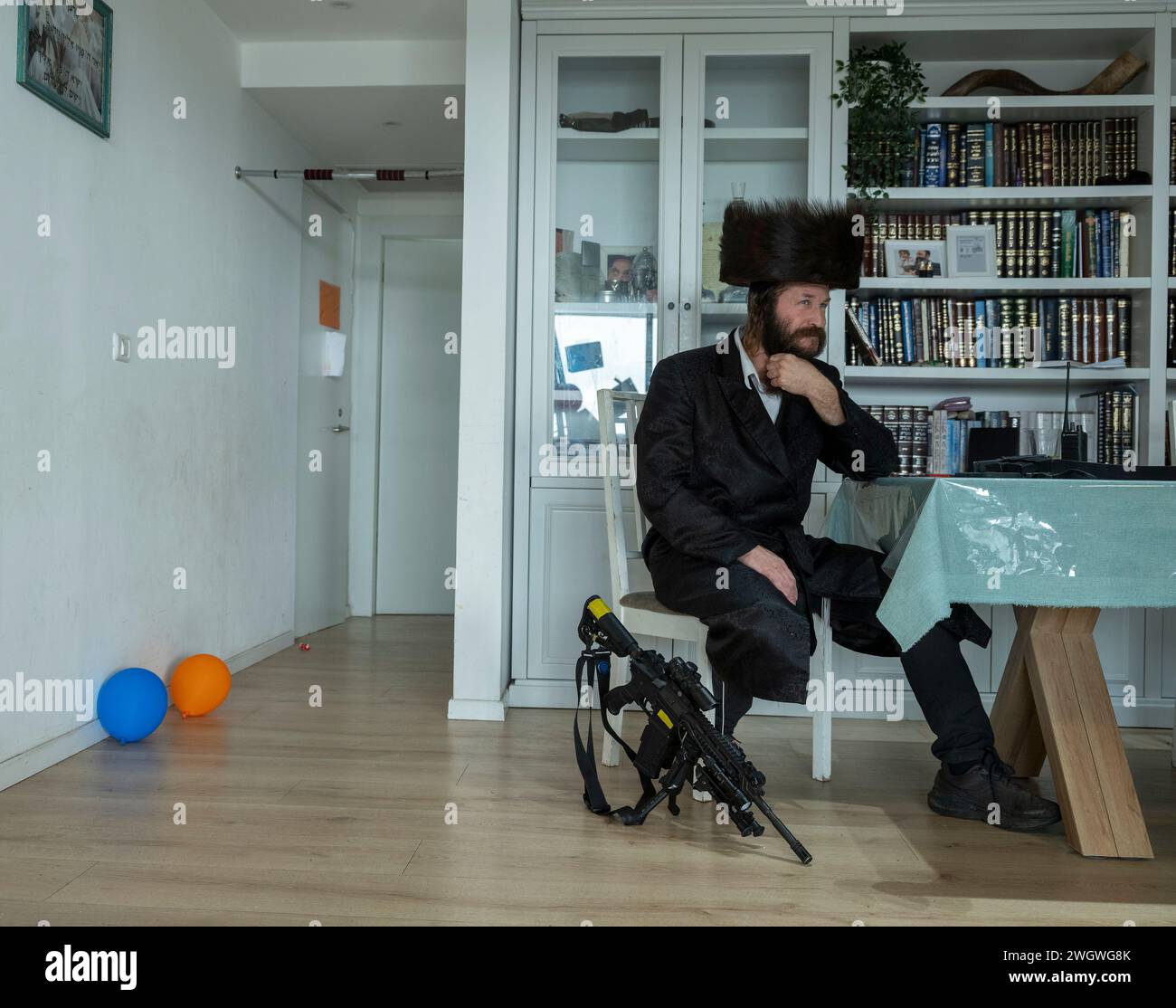 Assaf Peleg, today an Orthodox Jewish rabbi, in his apartment filled ...