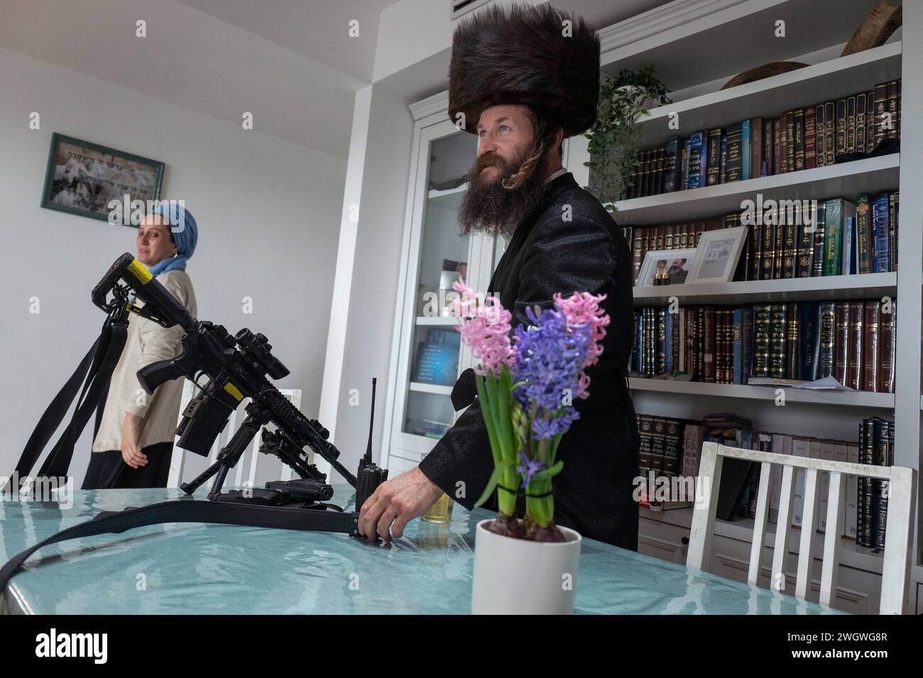 Assaf Peleg, today an Orthodox Jewish rabbi, in his apartment filled ...