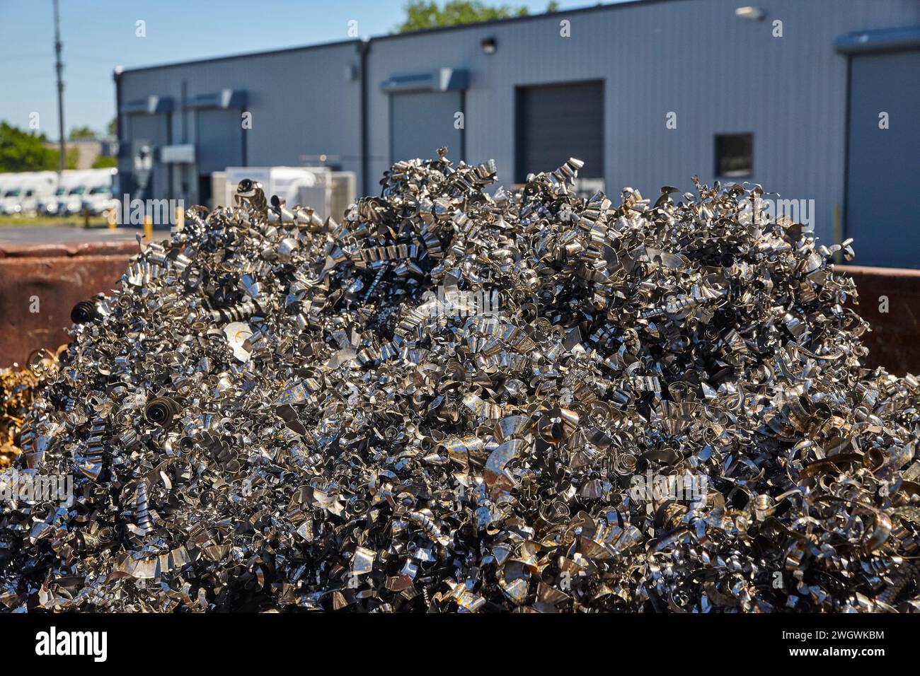 Industrial Metal Scraps and Warehouse Exterior in Sunlight Stock Photo ...
