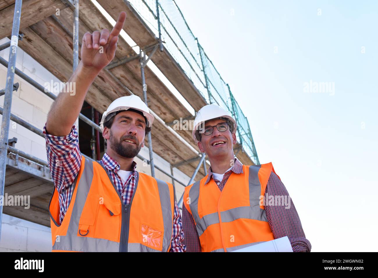 teamwork on the construction site - site manager and architect on site ...