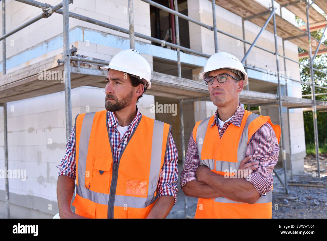 teamwork on the construction site - site manager and architect on site ...