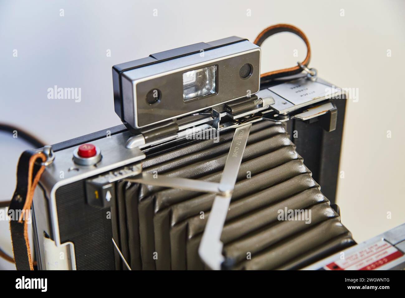 Vintage Folding Camera Close-Up with Red Shutter Button Stock Photo - Alamy