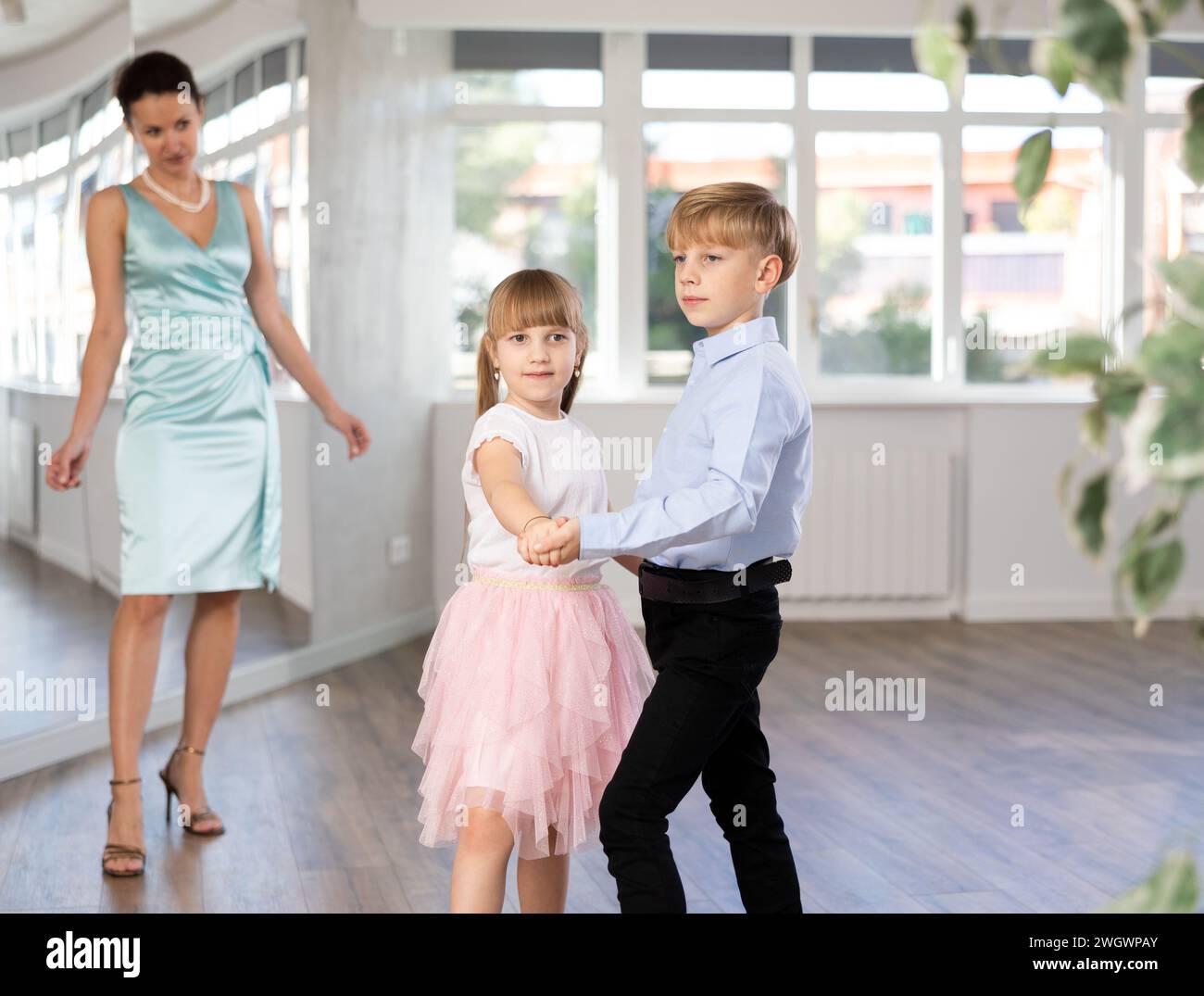 Tween dancers, girl and boy practicing waltz in dance studio Stock ...