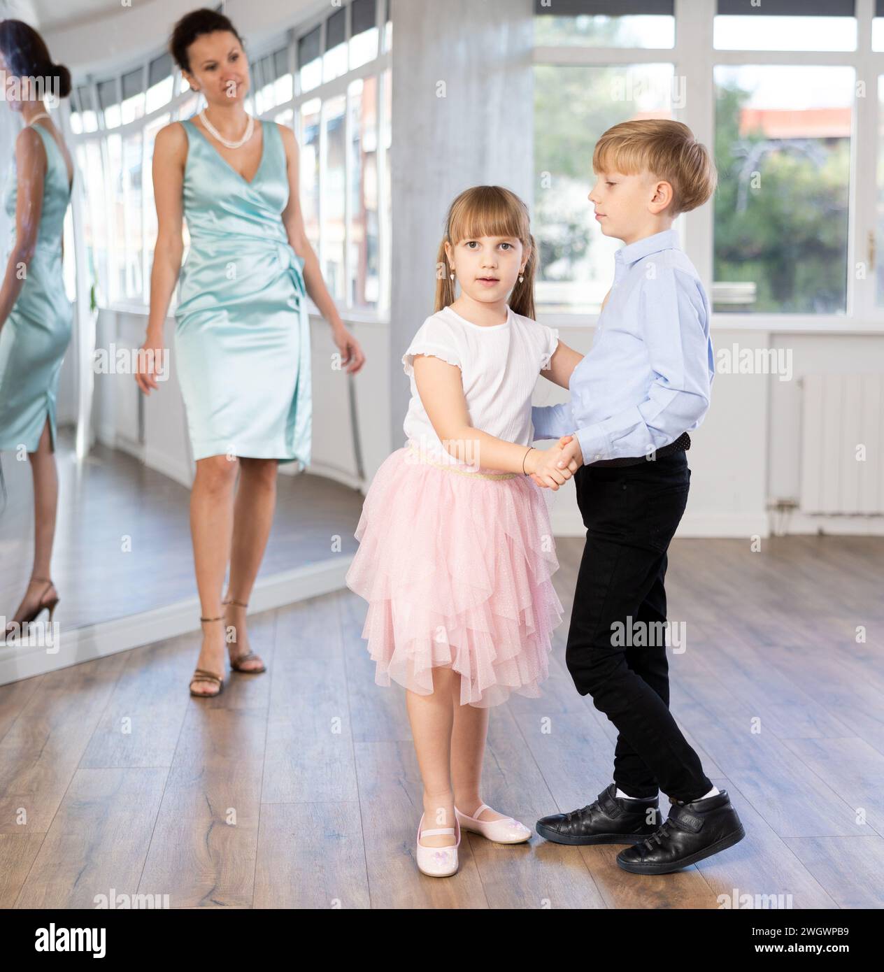Tween dancers, girl and boy practicing waltz in dance studio Stock ...