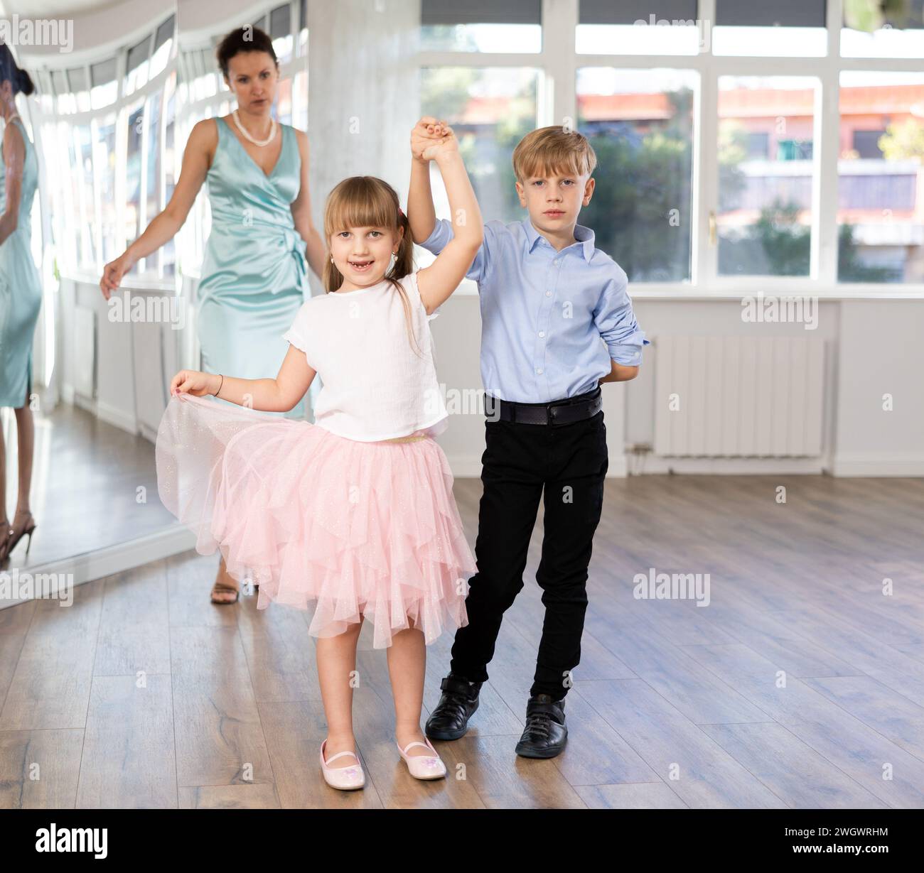 Boy and girl in pair train to dance contemporary vigorous waltz during ...