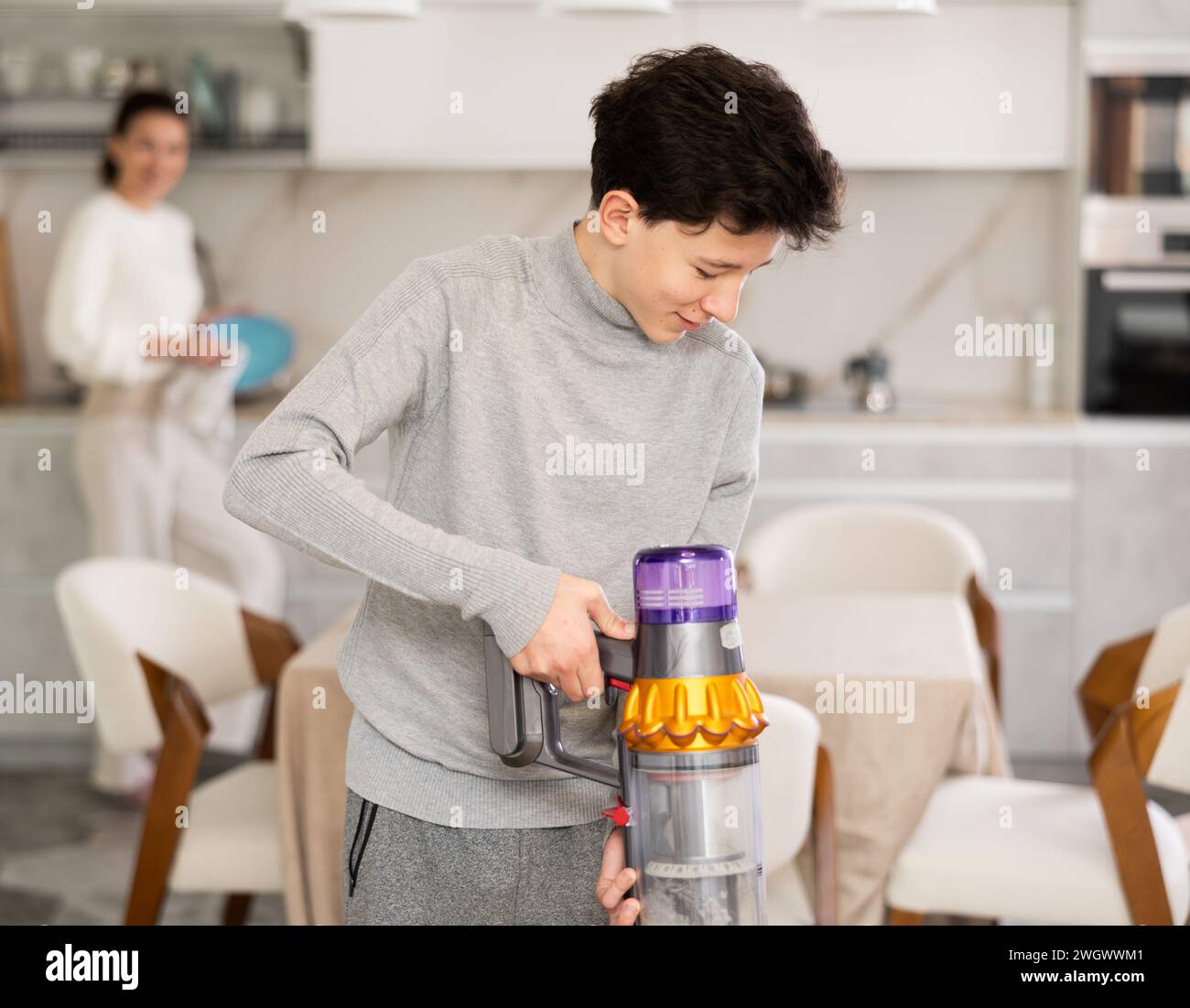 Teenager boy washing dishes hi-res stock photography and images - Alamy