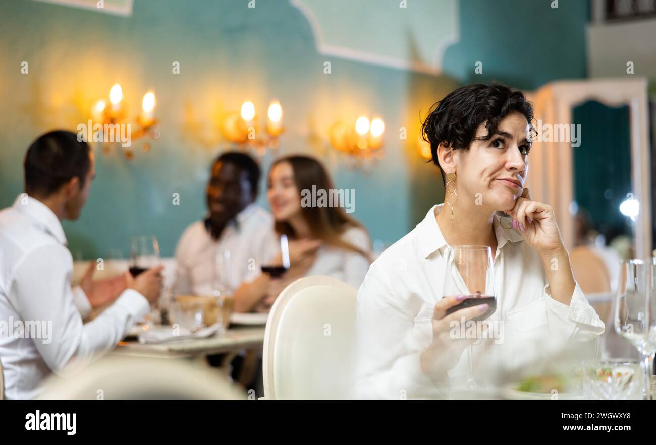 Unhappy eating in restaurant hi-res stock photography and images - Alamy
