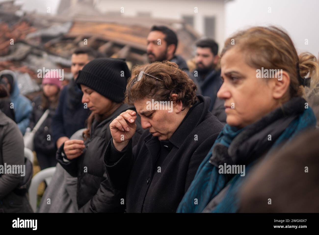 Hatay, Turkey. 06th Feb, 2024. A woman takes out a ritual cross. The ...