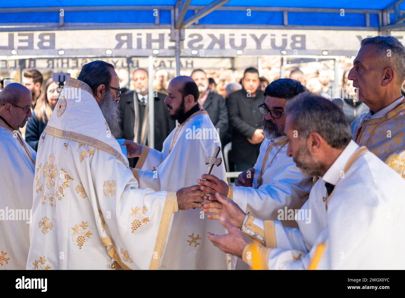 Hatay, Turkey. 06th Feb, 2024. The priest hands the cross to the ...