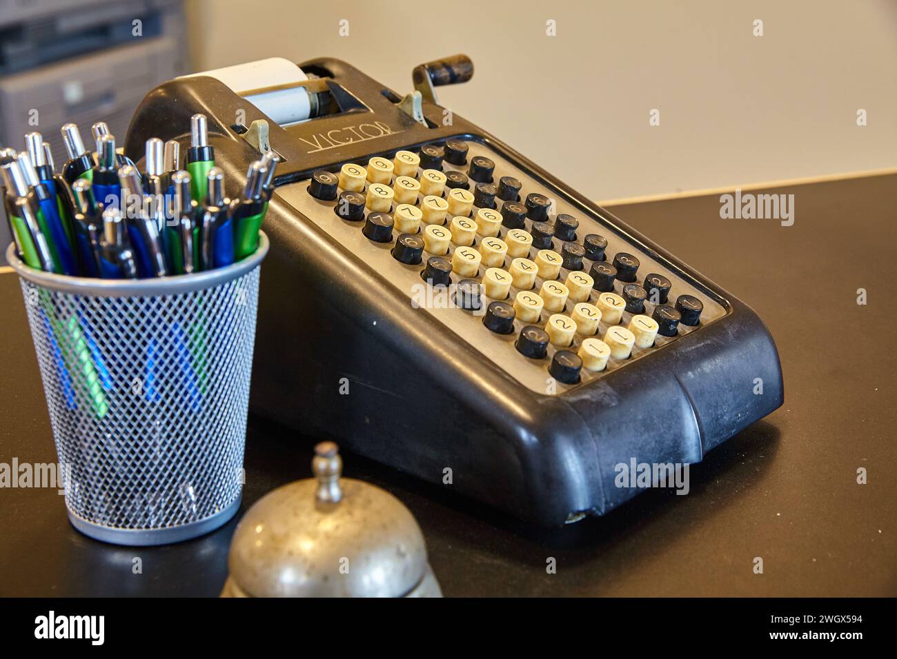 Vintage Adding Machine with Pens and Service Bell on Desk Stock Photo ...