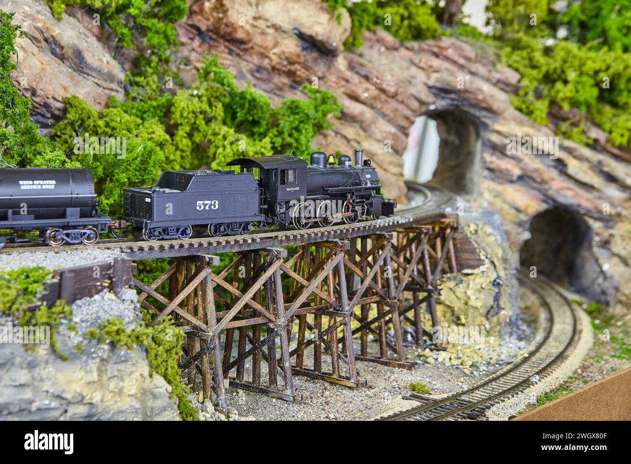 Miniature Model Train on Trestle Bridge with Scenic Landscape Stock ...