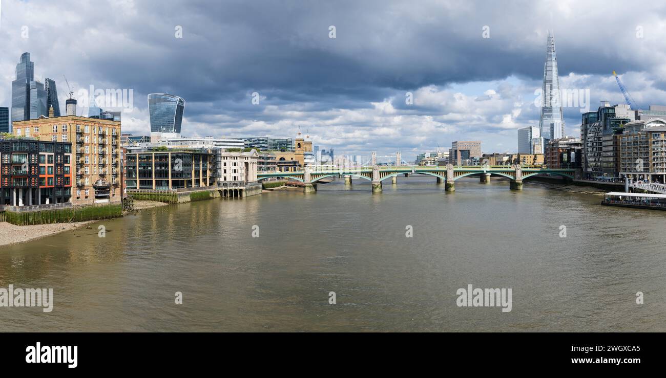 Panorama view east along River Thames in London under moody sky with ... Panorama view east along River Thames in London under moody sky with ...