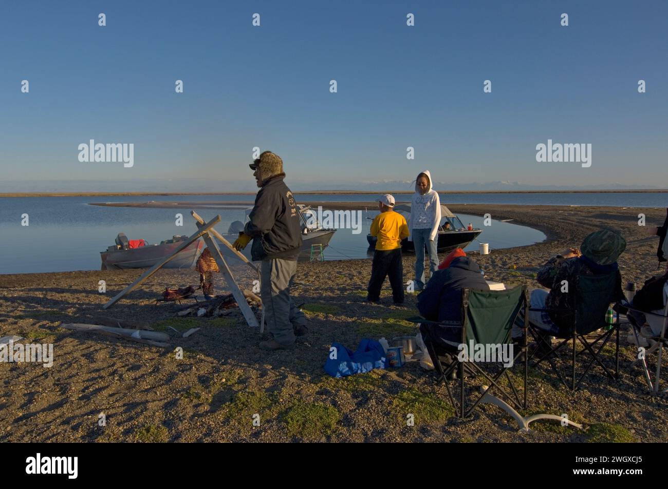 Eskimo Inupiat kids playing at camp on a sandspit along Demarcation bay ...