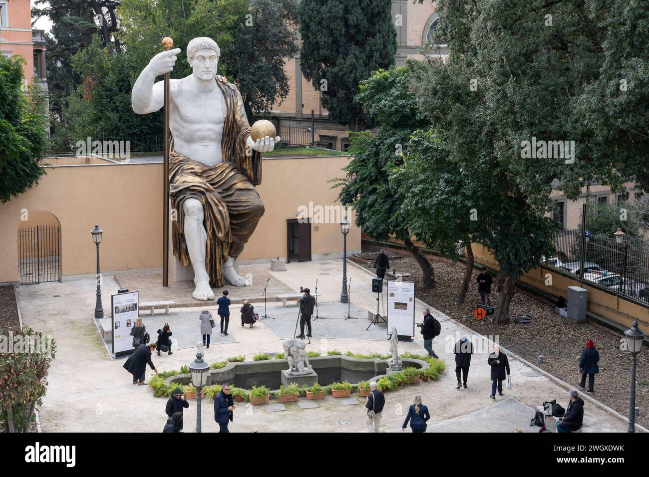 People attend the press preview of the reconstructed monumental statue ...