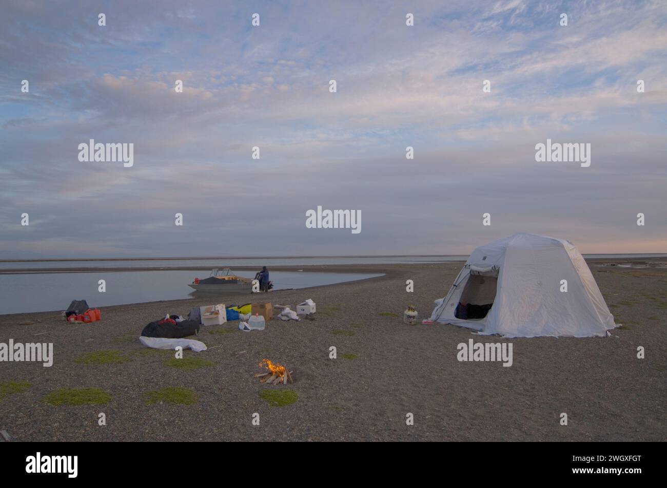 Eskimo Inupiat people kids playing at camp on a sandspit along ...