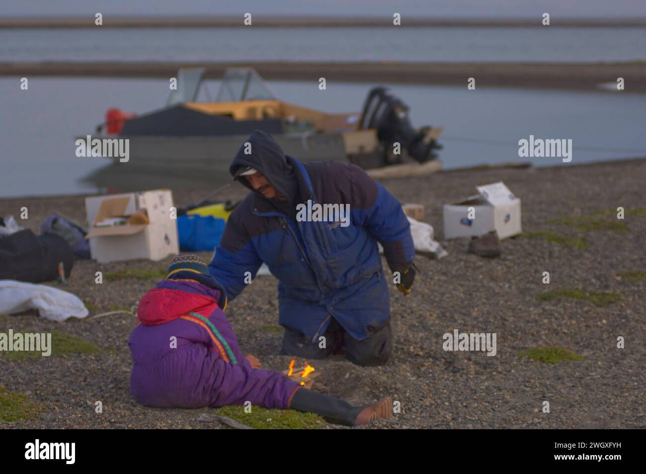 Eskimo Inupiat people kids playing at camp on a sandspit along ...