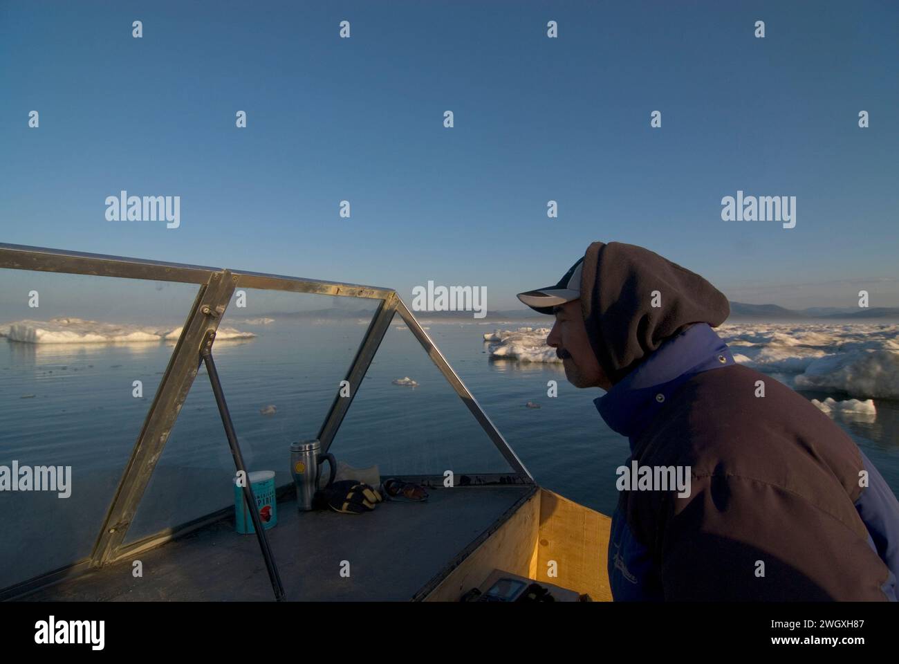Eskimo Inupiat person headed to camp on a sandspit along Demarcation ...