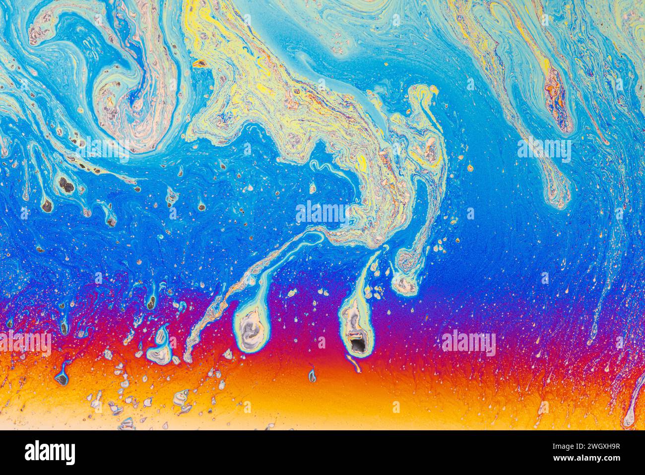 Colorful liquid mixture, blending paints in dynamic abstract fluid ...