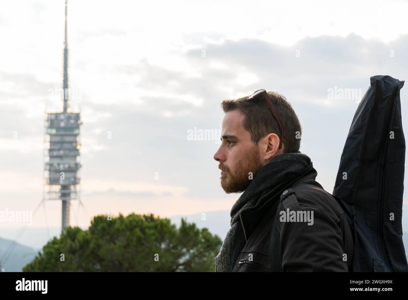 Engineer looking at the power plant after a hard working day in winter ...