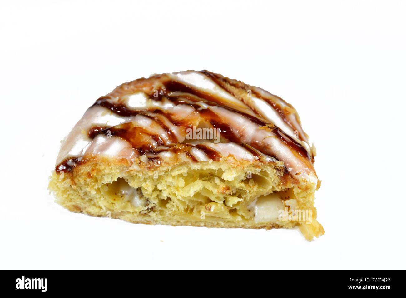 White chocolate and caramel sauce topping on a baked Danish pastry ...