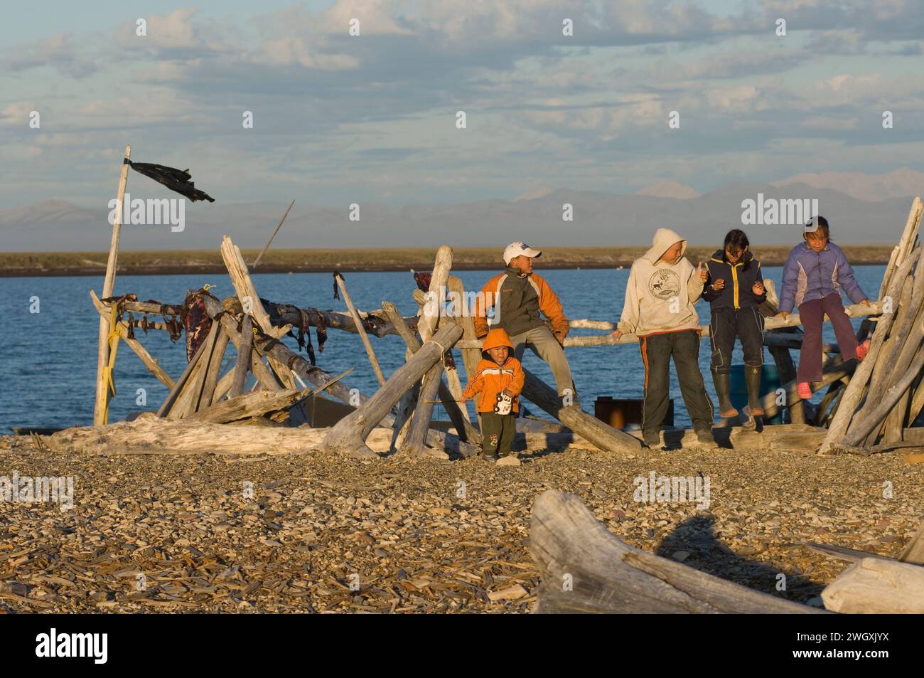 Eskimo Inupiat kids playing at camp on a sandspit along Demarcation bay ...