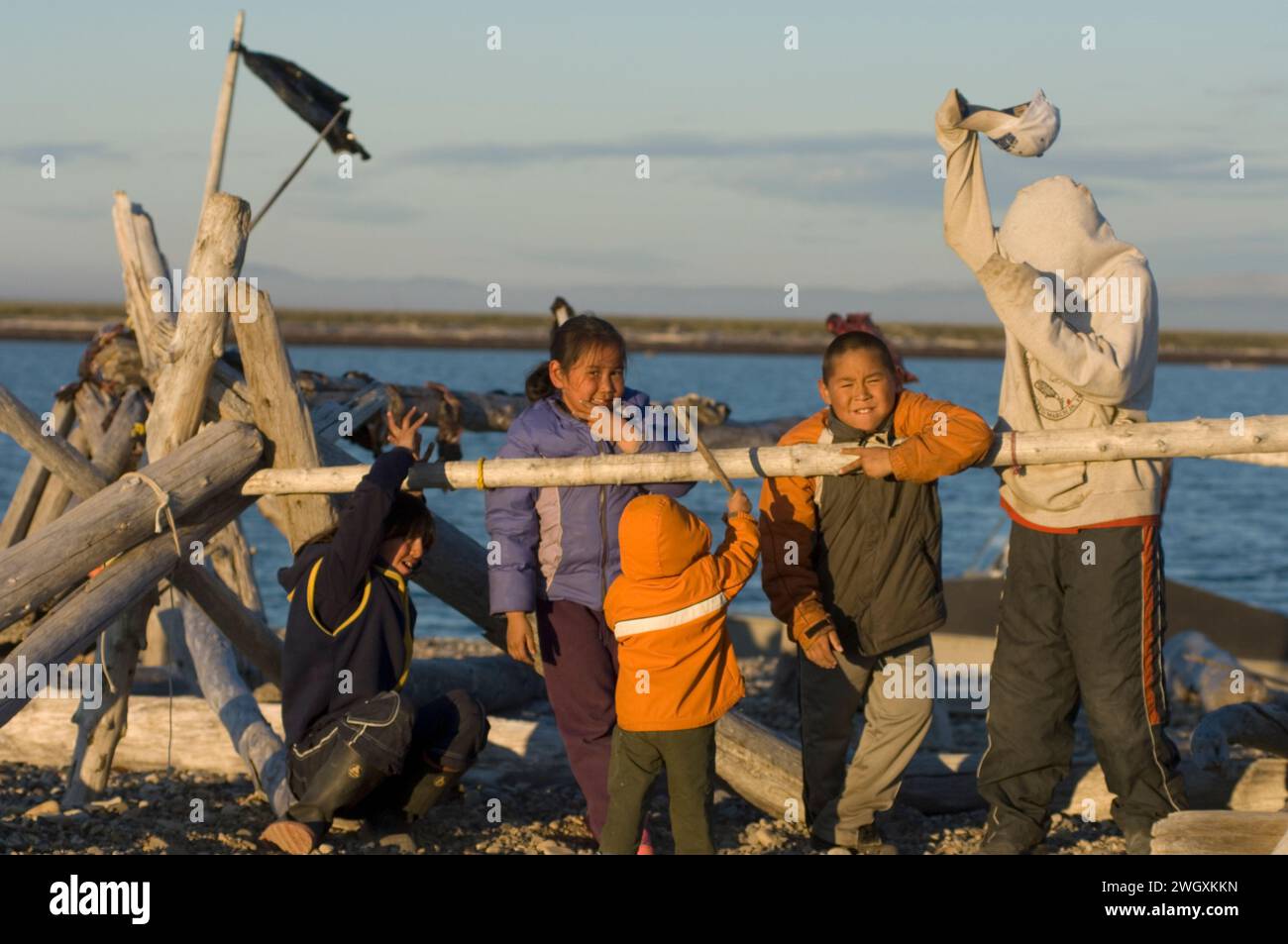 Eskimo Inupiat kids playing at camp on a sandspit along Demarcation bay ...