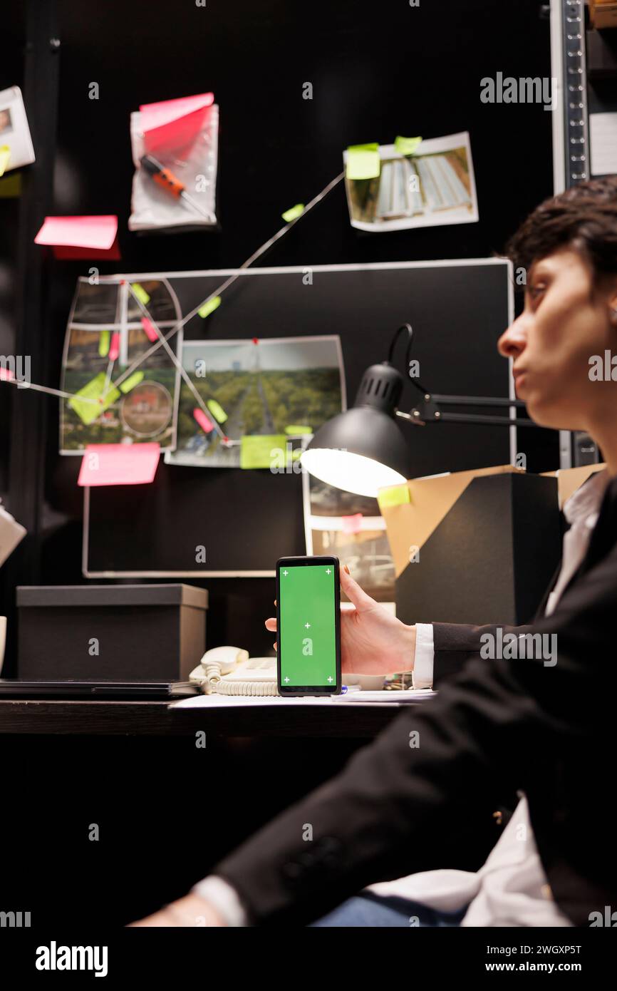Police officers showing mobile phone with green screen mock up chroma ...