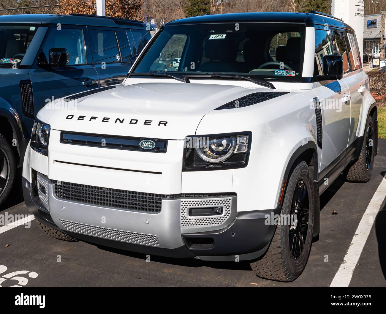 A Land Rover Defender for sale at a dealership Stock Photo - Alamy