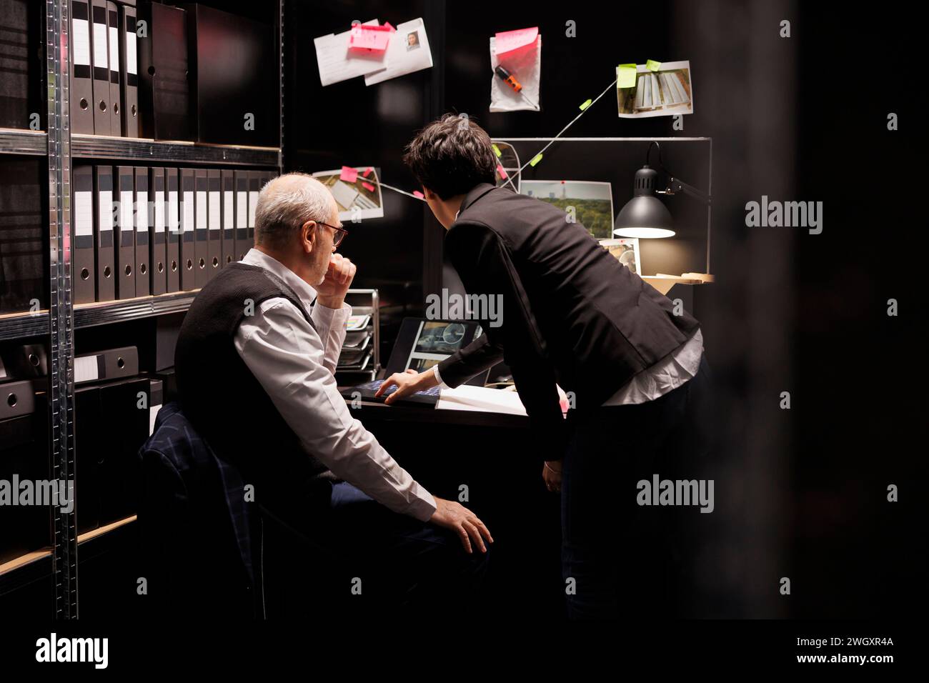 Fbi agents working at crime case analyzing investigation evidence late ...